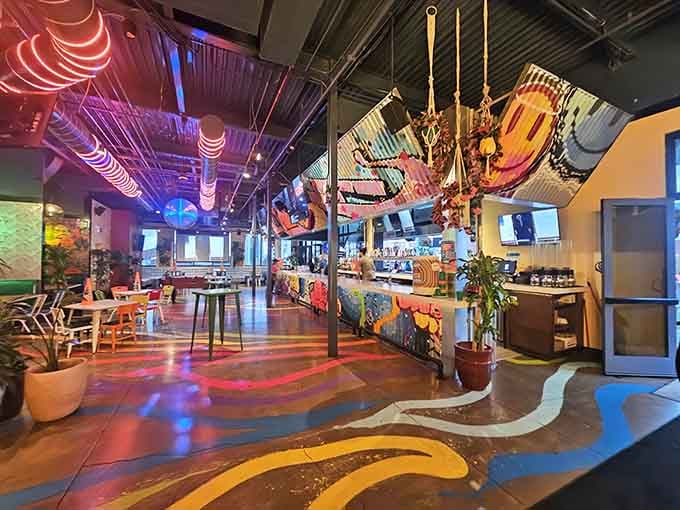 Step inside where neon dreams meet comfort food reality, and suddenly adulting doesn't seem so bad after all.