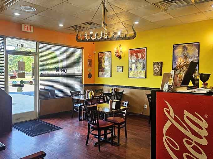 Bright yellow walls and Viking decor create a cheerful atmosphere that makes every meal feel like a celebration.
