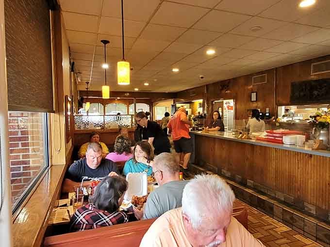 Wood tones and comfortable seating create the kind of welcoming atmosphere where lingering over dessert feels absolutely right.