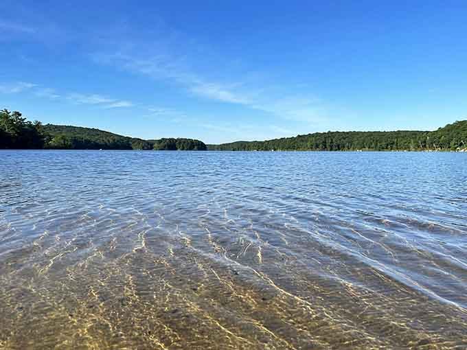 Crystal-clear water revealing the sandy bottom below, making you wonder why you've been settling for murky swimming spots.