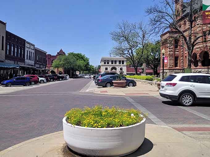 That courthouse tower peeking over the buildings is your North Star, guiding you through streets lined with architectural eye candy.