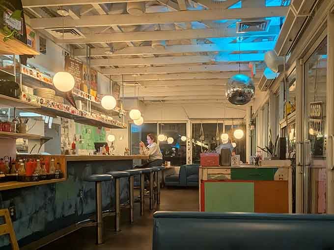 Inside, white-washed beams and globe lights create an atmosphere that's equal parts beach house and retro diner.