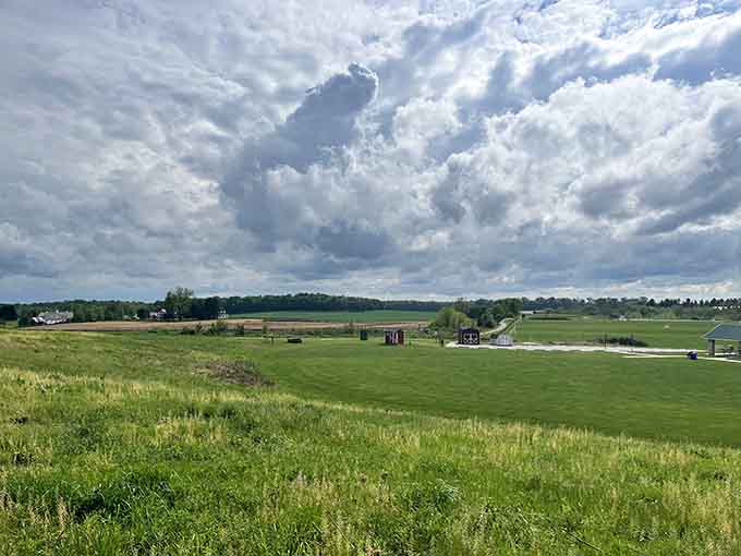 Rolling green fields under dramatic skies, where weekend warriors and casual picnickers share the same beautiful backyard.