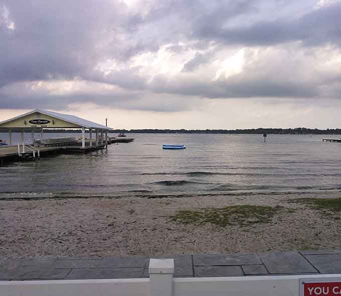 Even under moody skies, this lake maintains its serene dignity like a Southern gentleman in a rainstorm.