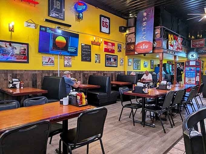 Bright yellow walls and vintage signs create the kind of welcoming atmosphere where strangers become friends over shared plates.