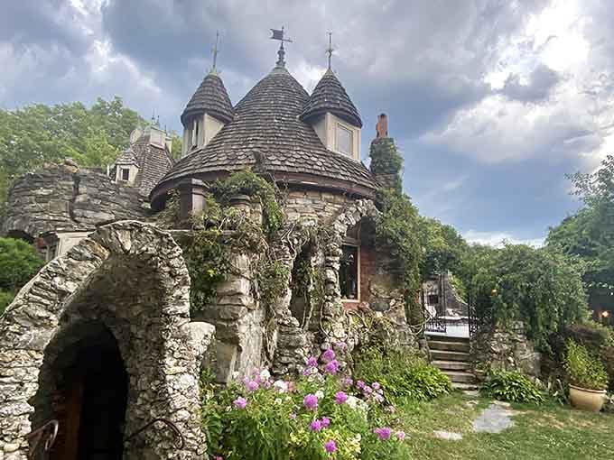 Stone archways and flowering gardens frame this handcrafted marvel that proves dreams really can become solid reality.
