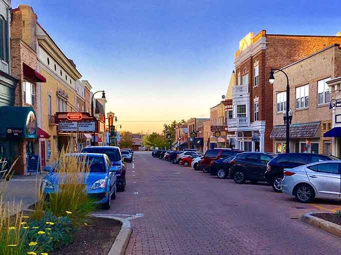 Golden hour on a small-town main street where the biggest traffic jam involves someone parallel parking their SUV.