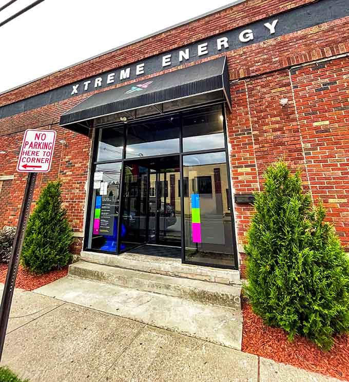 The brick facade and colorful entrance promise adventure, like finding Willy Wonka's factory but for active kids instead.