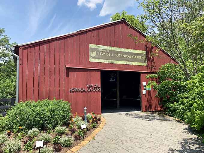 The charming red barn serves as your gateway to botanical bliss and garden inspiration galore.