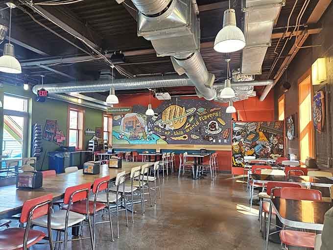 Inside Zingerman's Delicatessen, vibrant murals and industrial chic create the perfect backdrop for serious sandwich consumption.