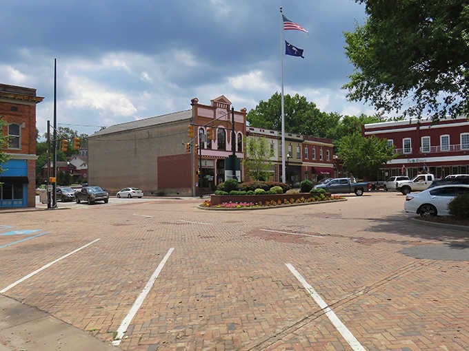 That brick plaza and flowering median tell you everything about a town that values beauty without breaking the bank.