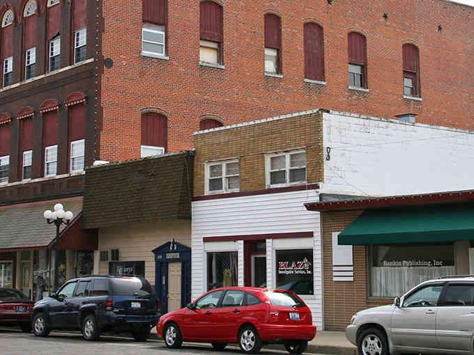 These vintage facades stand shoulder to shoulder like old friends who've weathered every storm together since the Eisenhower administration.