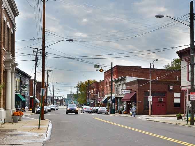 Wide streets and weathered brick buildings capture that authentic small-town rhythm where life moves at a gentler pace.
