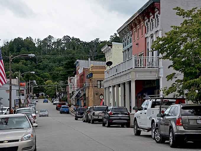 Colorful buildings cascade down the hillside, creating a postcard-perfect scene that never loses its charm no matter how many times you see it.