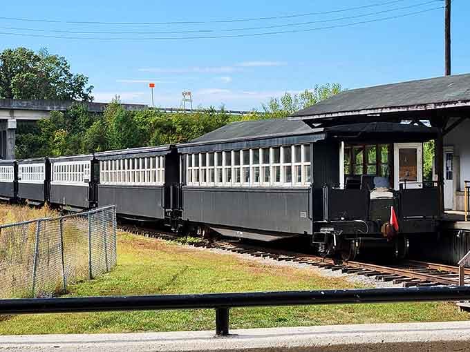 These charming gray passenger cars waiting at the station remind you of simpler times when trains ruled travel.
