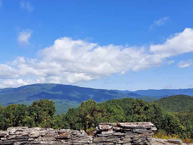 Stacked stone and summer greenery meet brilliant blue skies in this postcard-perfect mountain vista that never gets old.