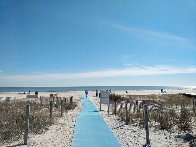 That blue walkway rolls out like a welcome mat straight to the sparkling Atlantic Ocean.