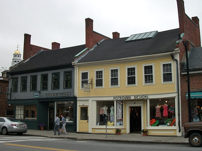 Classic storefronts with cheerful yellow trim remind you that some towns still value charm over chain stores.