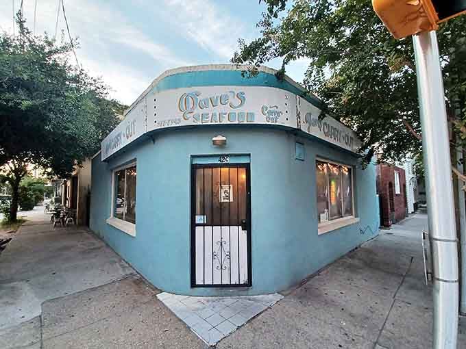 This turquoise corner building glows like a Caribbean postcard dropped into a Charleston neighborhood, promising fresh seafood inside.