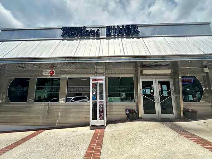 Classic chrome lettering on a silver facade signals serious comfort food ahead, no frills required for satisfaction.