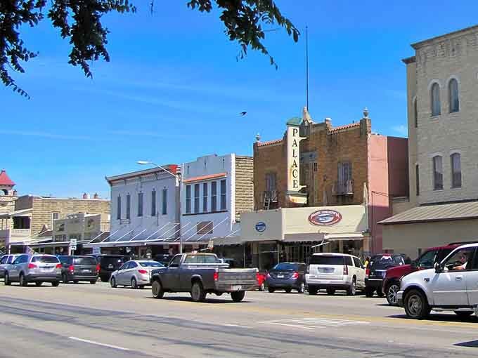 The Palace Theatre marquee stands proud among colorful facades where German heritage meets Hill Country charm beautifully.