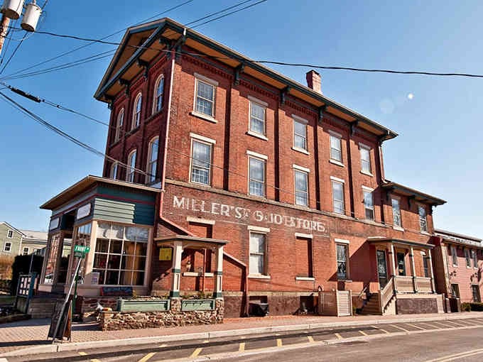 That historic brick building has seen more stories than your favorite library, standing proud since horse-and-buggy days.