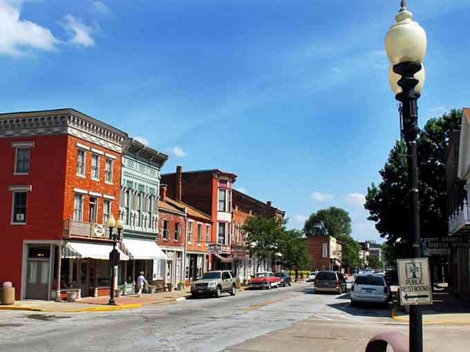 Vintage lampposts and sunny skies frame this Main Street like a Norman Rockwell painting come alive.