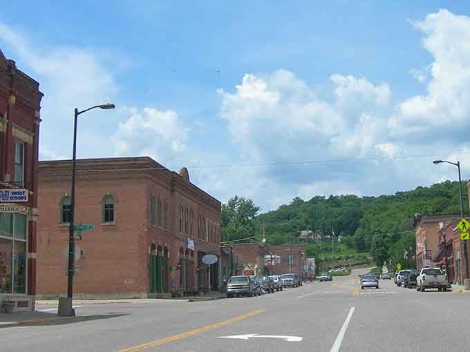 Henderson's brick-lined Main Street stretches toward green bluffs like a postcard that somehow never made it to the rack.