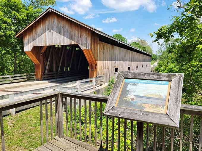 The weathered wood tells stories of decades past while that informative plaque shares the bridge's fascinating history.