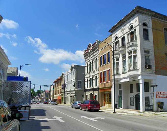 These colorful Victorian buildings stand proud under blue skies, showing off their architectural bones with timeless style.