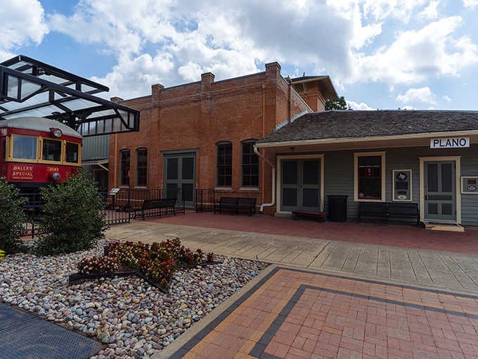 The old Plano station depot sits quietly, its brick walls holding stories of electric railways and Sunday travelers.