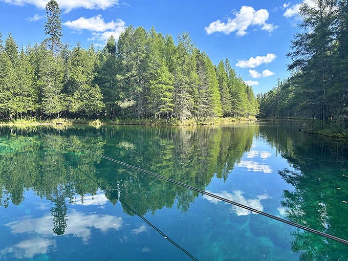 Crystal-clear turquoise water so transparent you'll swear someone installed an underwater window to another world below.