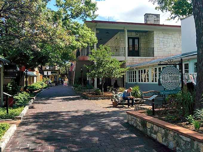 Brick pathways wind through charming courtyards where history and artisan shops blend beautifully together in perfect harmony.