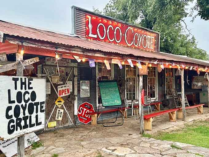 Rustic charm meets quirky character at this weathered roadside spot where every sign tells a story.