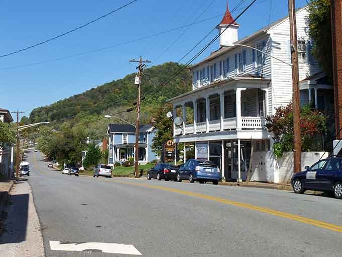 Take a peaceful drive through this historic Virginia town, where charming white buildings rest against a backdrop of rolling hills.