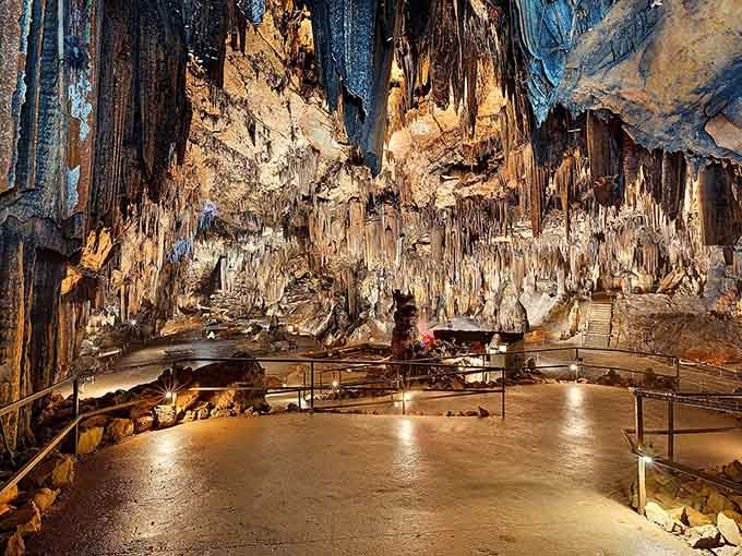 Stalactites hang like nature's chandelier collection, each one dripping with thousands of years of patient, artistic dedication.