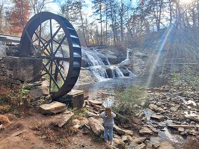 That historic water wheel spinning beside cascading falls proves old-fashioned engineering still steals the show beautifully.