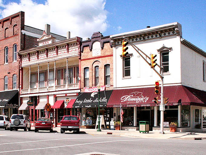Historic buildings with ornate balconies stand proud like they're auditioning for a classic movie set about small-town America.
