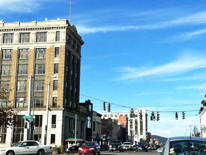 Wide mountain-town streets stretch toward distant hills, promising fresh air and rent prices that won't break the bank.