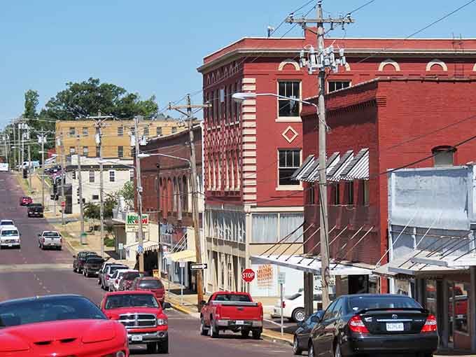 Red brick buildings rise up along the hillside, creating a downtown that feels like a movie set.