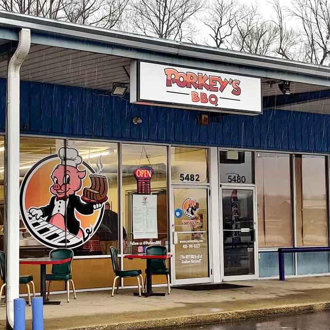 That cheerful pig mascot wearing a chef's hat tells you everything about the fun waiting inside this BBQ joint.
