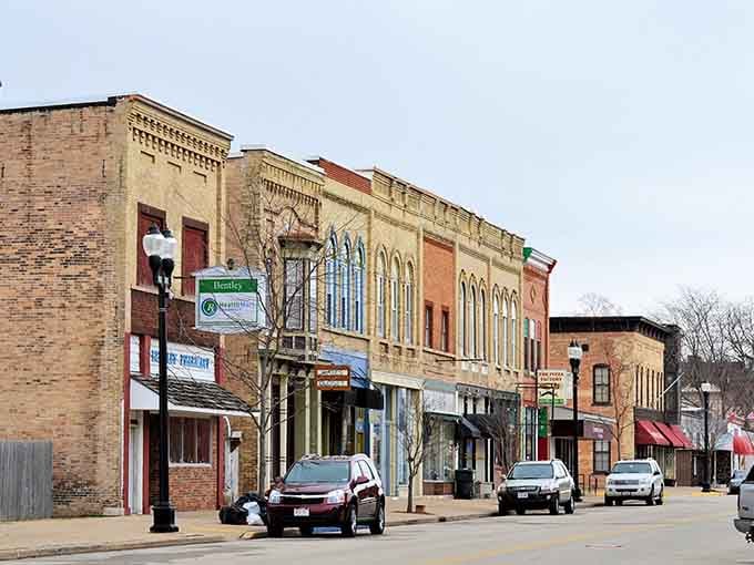 Classic brick facades stand proud along this quiet street, where time moves at a wonderfully unhurried pace.