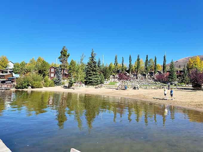 Crystal-clear water meets genuine sand where mountain cabins dot the shore&mdash;talk about having it all!