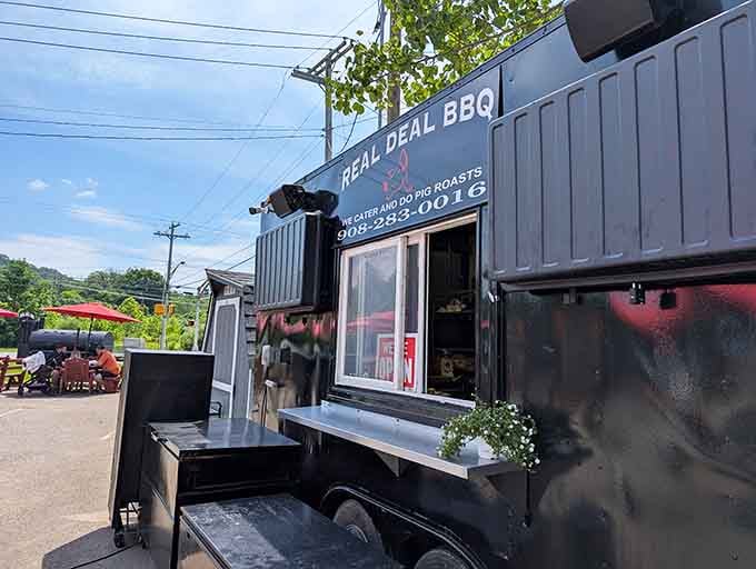 The industrial-chic black exterior promises modern barbecue excellence with traditional low-and-slow cooking methods inside.