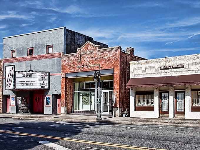 That vintage theater marquee stands proud like a beacon, reminding us when every town had its own picture show.