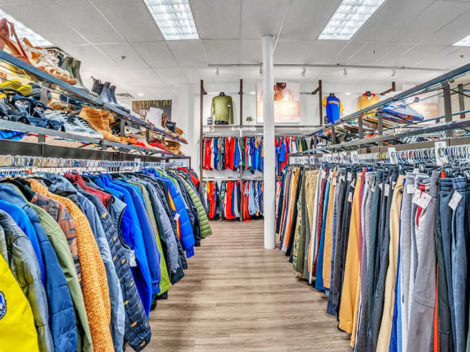 A rainbow wall of jackets and coats packed so tightly together, your next favorite outfit is definitely hiding in there.