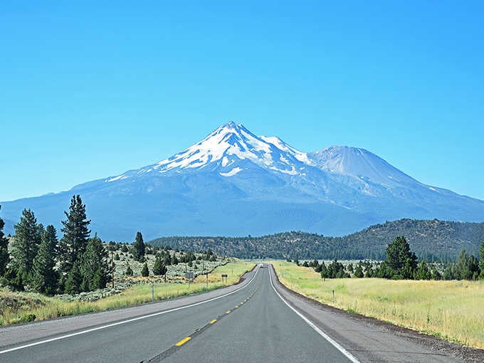 Mount Shasta rises ahead like a snow-covered sentinel, commanding attention from every angle of this volcanic wonderland.