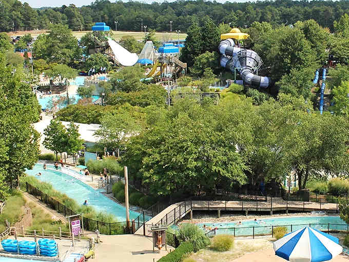 That aerial view reveals a waterpark wonderland tucked among the trees like a hidden treasure waiting.