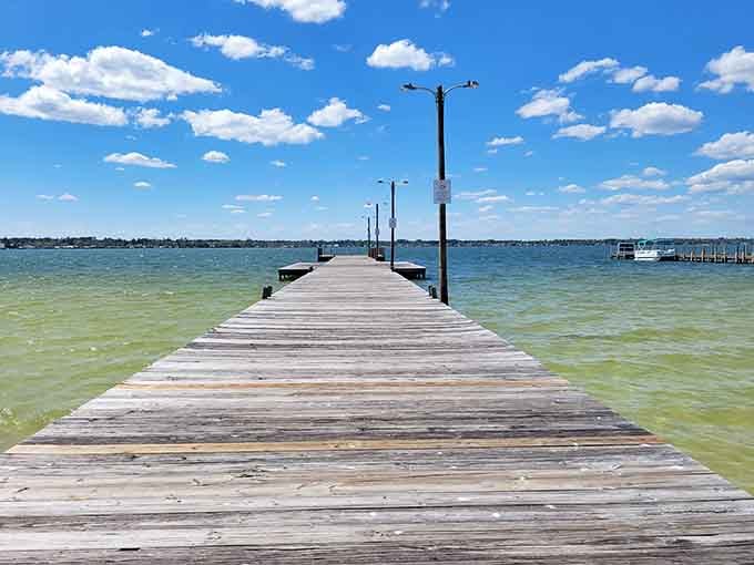 This wooden pier stretches toward turquoise water so clear you'll swear someone Photoshopped it.
