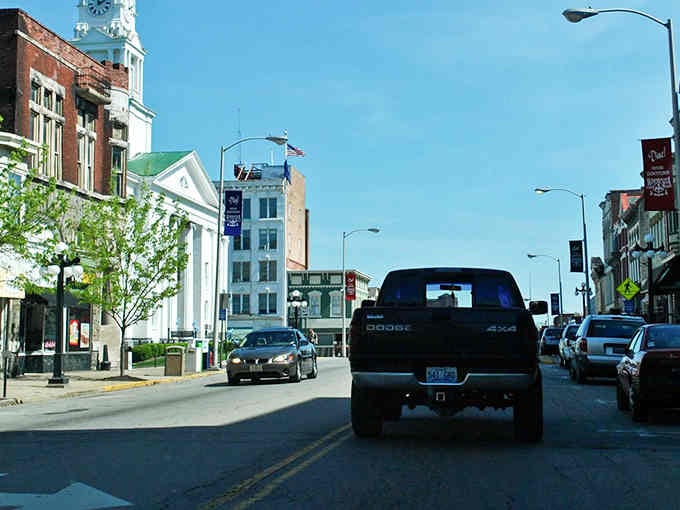 Main Street stretches ahead with that perfect small-town rhythm where neighbors still wave and nobody's in a hurry.